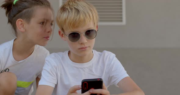 A Boy Tells a Surprising News to a Friend, Stock Footage | VideoHive