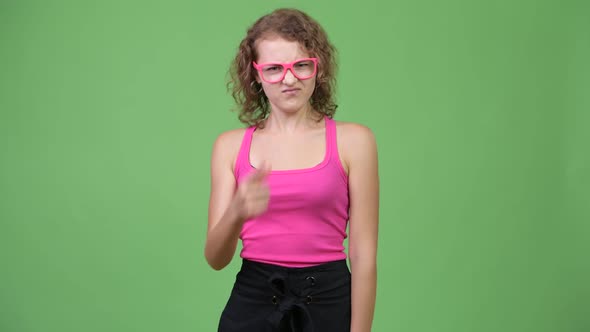 Young Angry Nerd Woman Talking and Pointing To Camera, Stock Footage