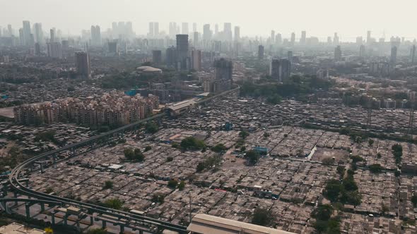Aerial view of both high-rise buildings and slums in Mumbai city ...