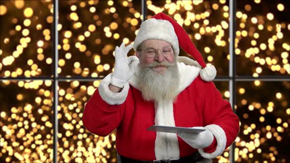Santa with Tablet Showing Ok Sign, Stock Footage | VideoHive