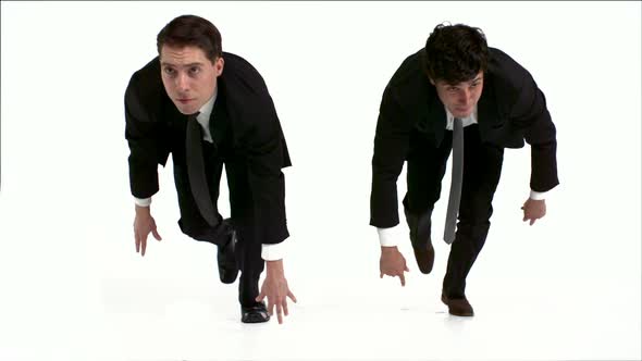 Young business men taking off at the starting line and running, Slow ...