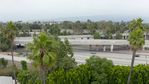 Side View on Los Angeles Two-level Freeway with Fast Moving Cars. Palm ...