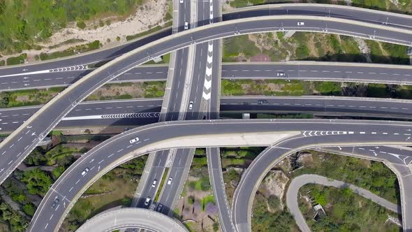 Massive multi level highway interchange with traffic on all routes ...