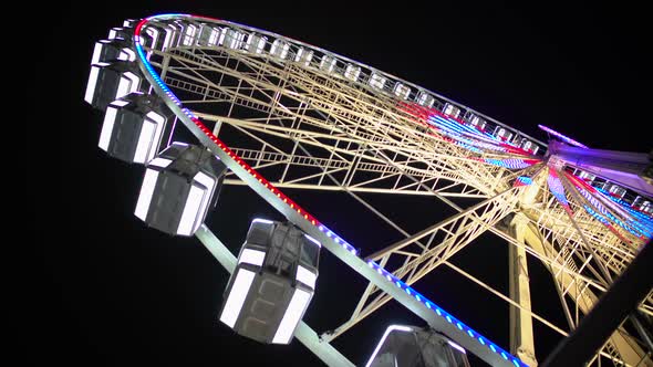 Giant Wheel Starts Rotating and Gaining Speed, Bright Illumination ...