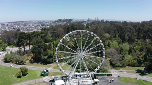 Push-in aerial shot of the SkyStar Ferris Wheel in Golden Gate Park ...
