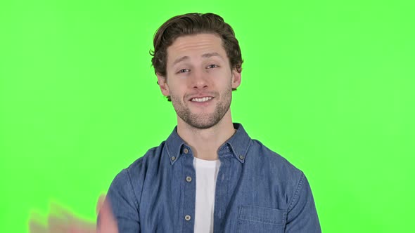 Hello, Young Man Waving and Cheering at the Camera on Green Chroma Key ...