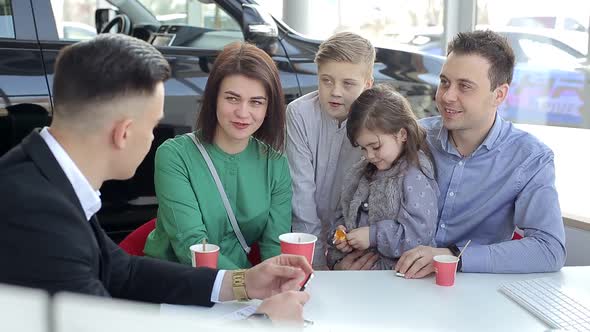 Happy Family Buy New Car Car Dealer Handshaking with Daddy ...