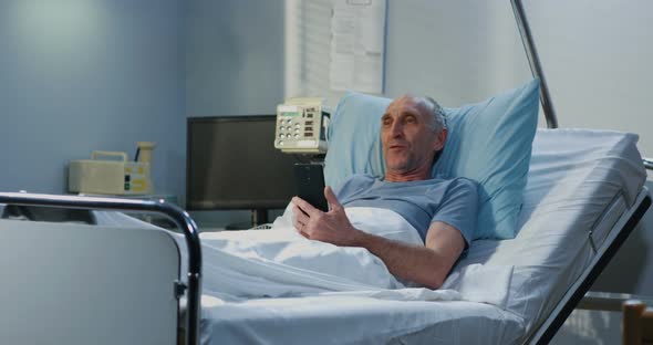 Male Patient Using Video Call in Hospital Room, Stock Footage | VideoHive