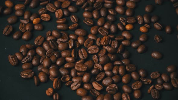 Closeup of Mocha Coffee Beans Fall and Bounce on the Table, Stock Footage