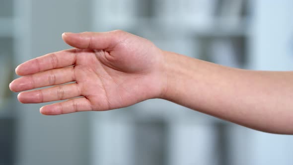 Bare Female Hand Held Horizontally with Palm towards Camera, Stock Footage