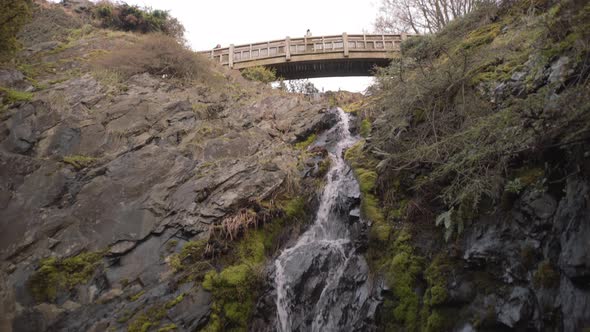 Revealing shot of small waterfall in Victoria park, Vancouver, Stock ...