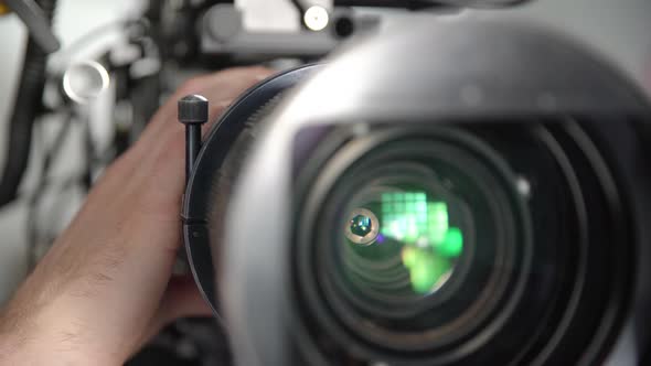 Extreme close up of lens aperture closing in massive telephoto lens ...