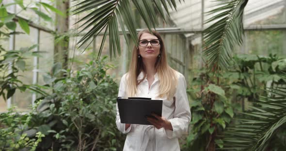 Biologist Scientist Conducts Research In The Botanical Garden, Stock ...