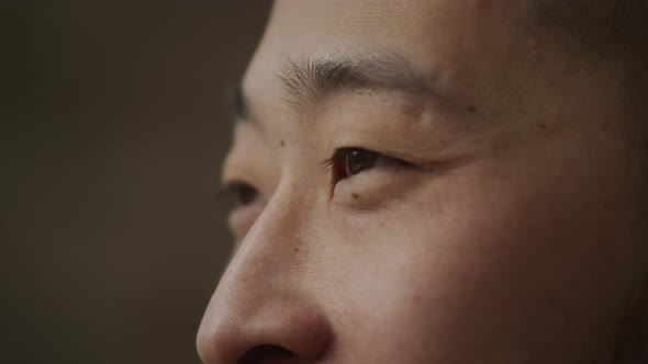 Side View of an Asian Man's Eyes Looking and Blinking, Stock Footage