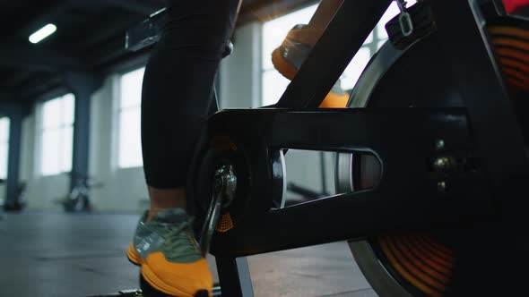 Closeup Athletic Woman Leg Spinning Exercising Workout on Stationary ...