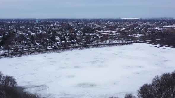 An aerial view from a drone, over a square lake during sunrise on a ...