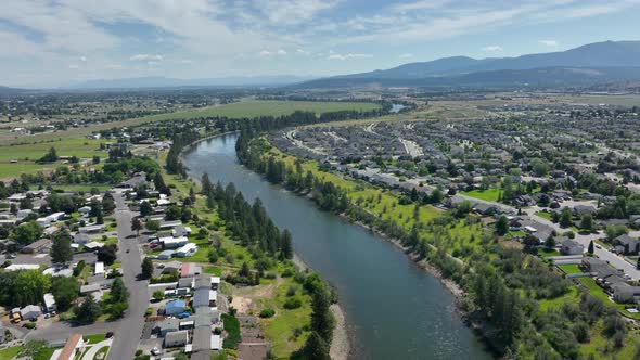 Wide aerial view of the Spokane Valley with the Spokane River cutting ...